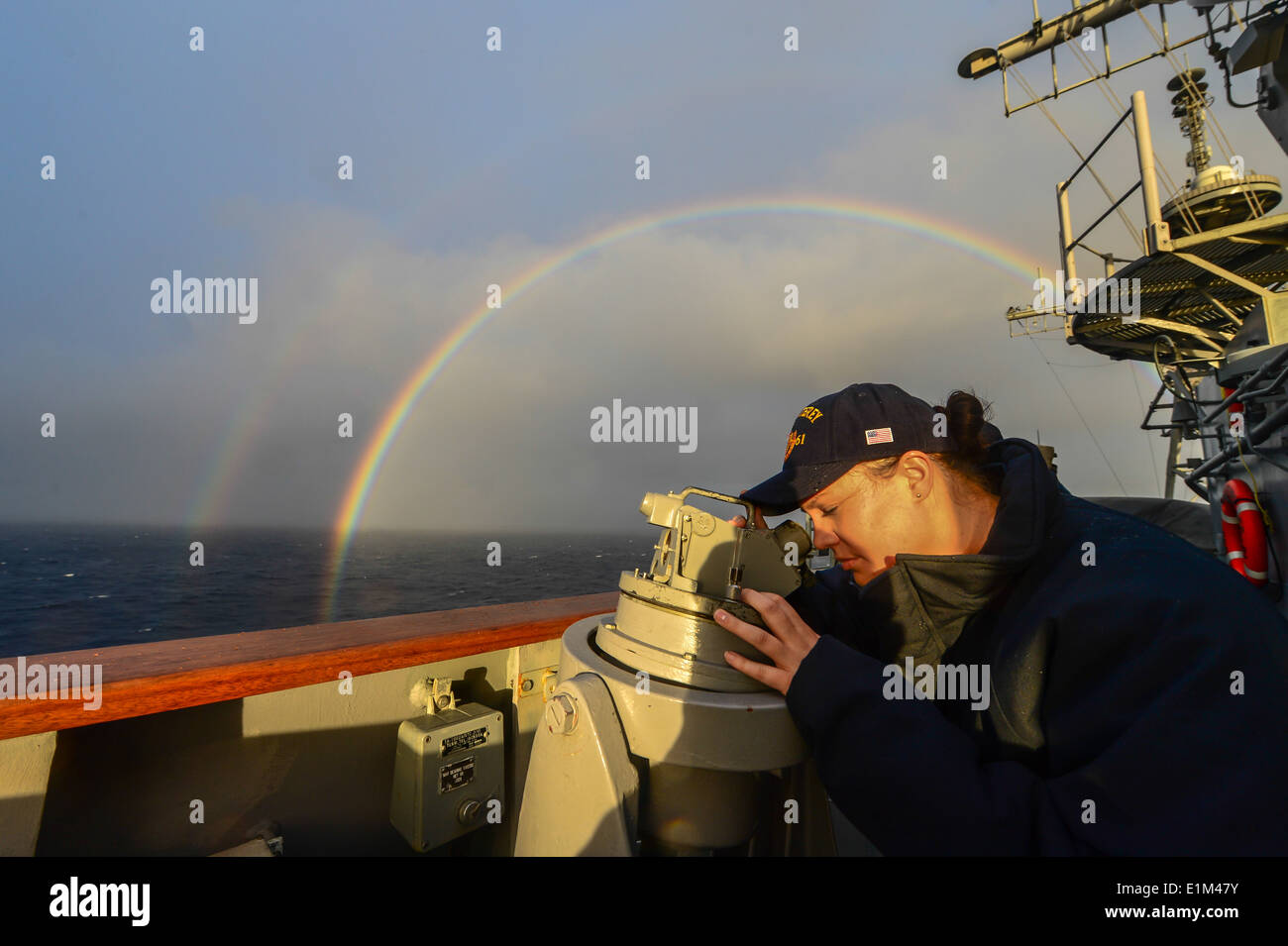 U.S. Navy Lt. j.g. Christina Sears looks through a telescopic alidade ...