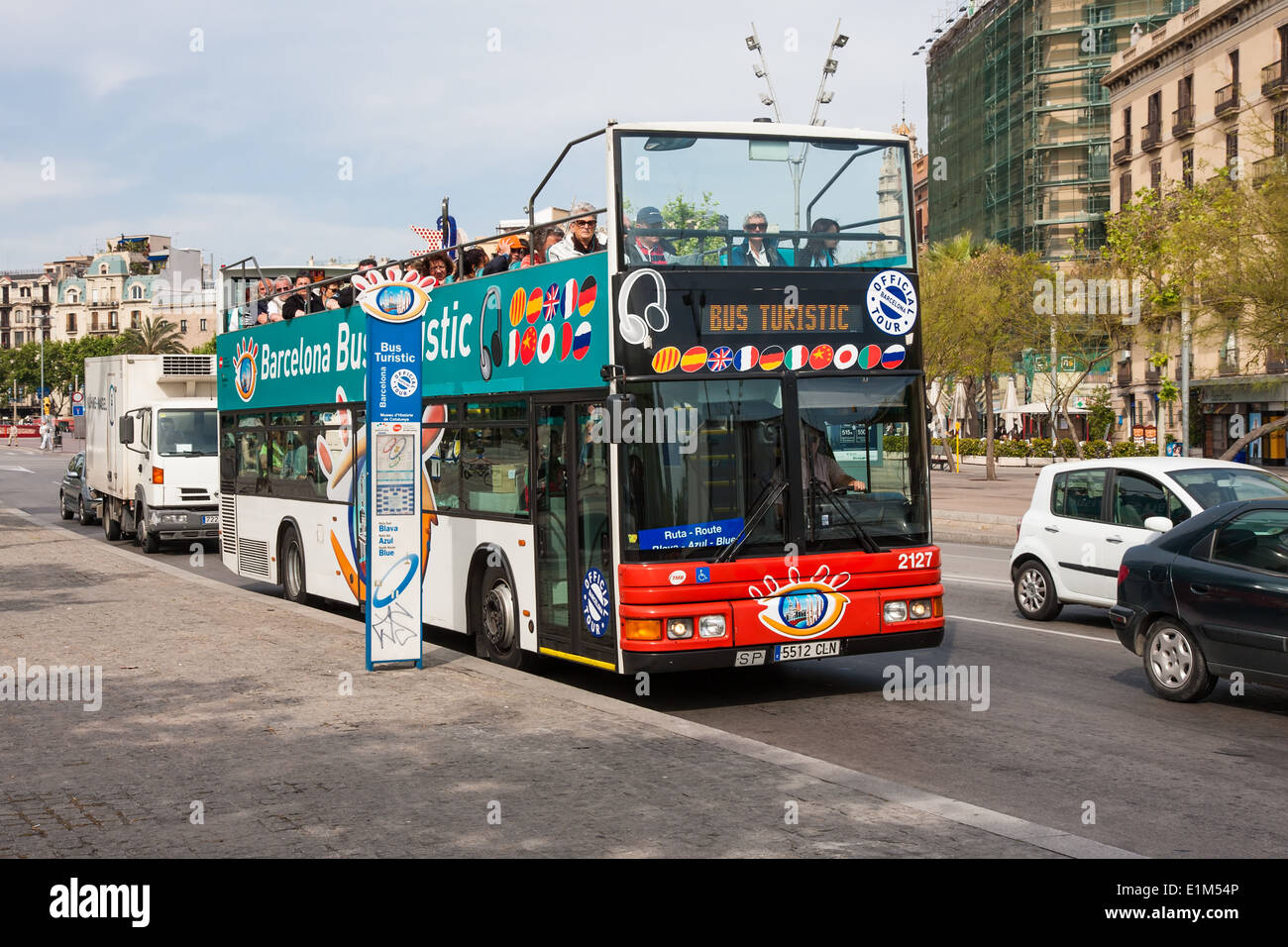 BARCELONA, SPAIN - MAY 08: Bus stop and sightseeing bus with tourists ...
