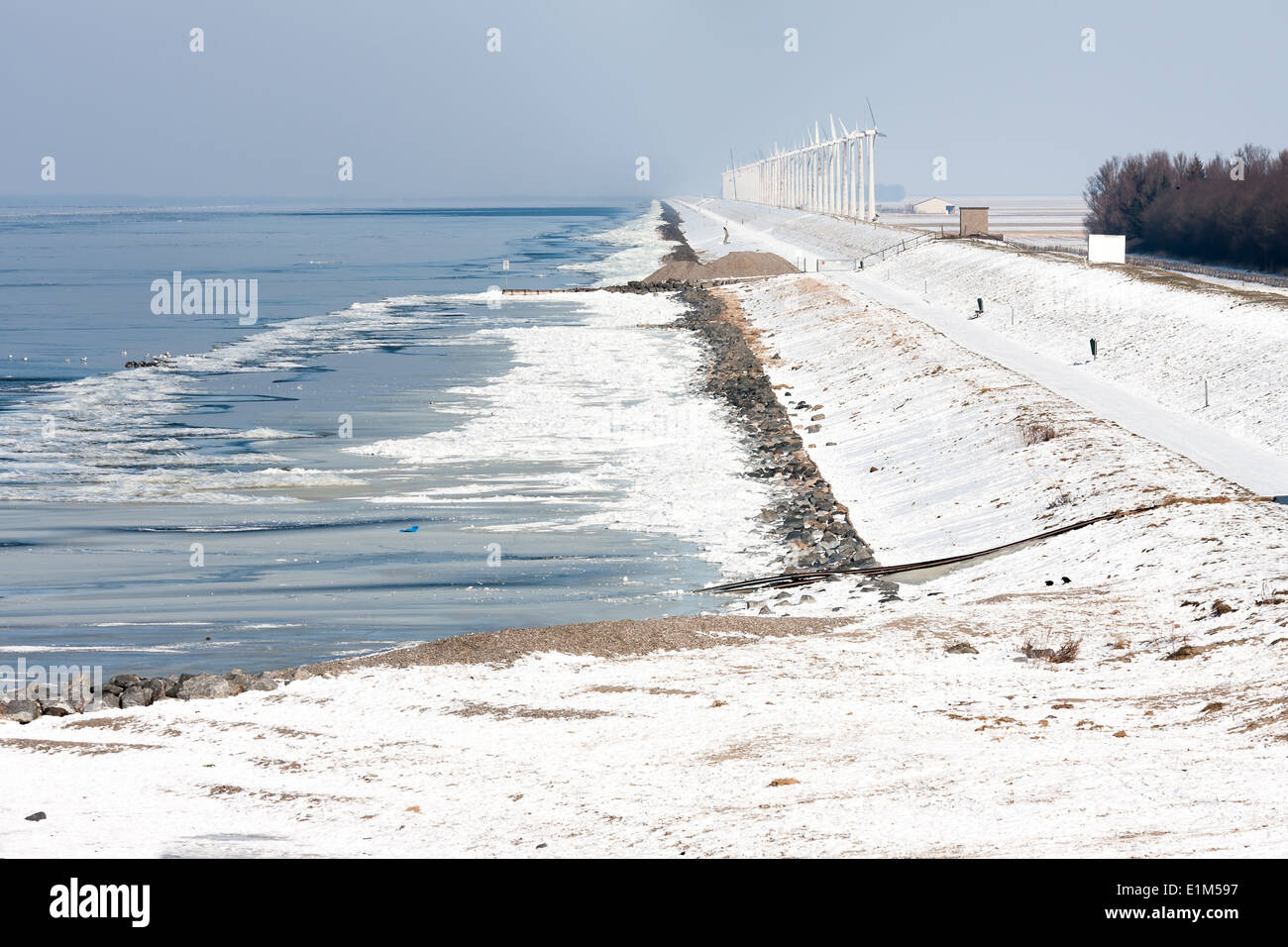 Dutch coast with wind turbines in wintertime with frozen sea Stock ...