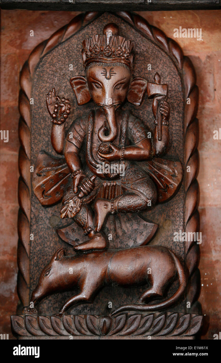 Elephant-headed Hindu god Ganesh straddling a rat Stock Photo - Alamy