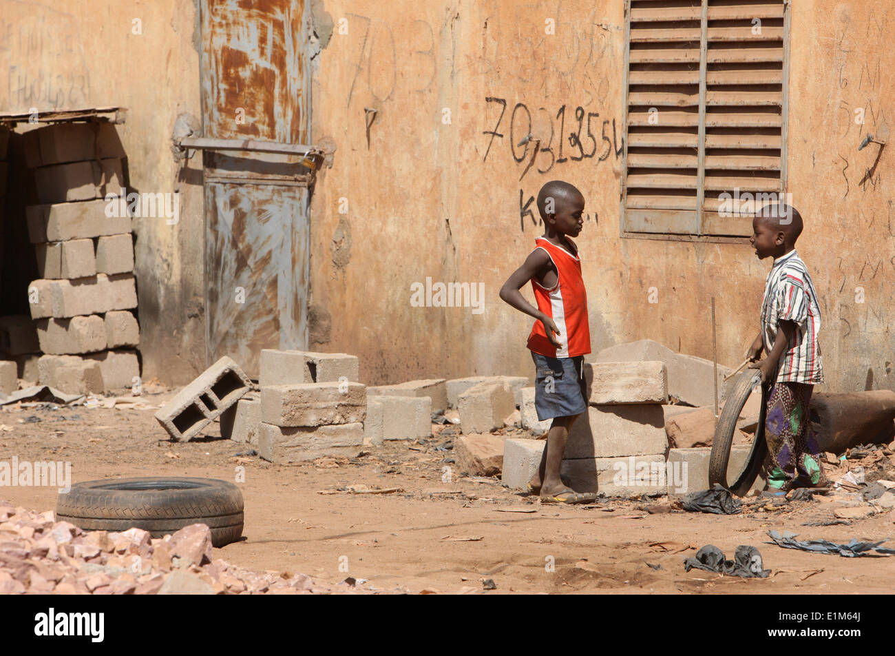 Two african boys playing in a poor district Stock Photo - Alamy