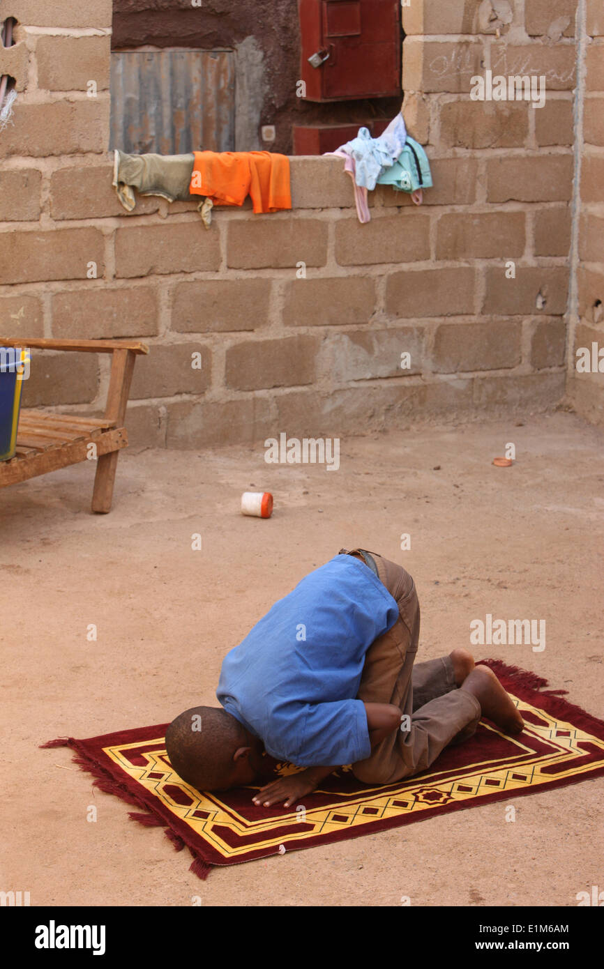 African boy praying at home Stock Photo - Alamy