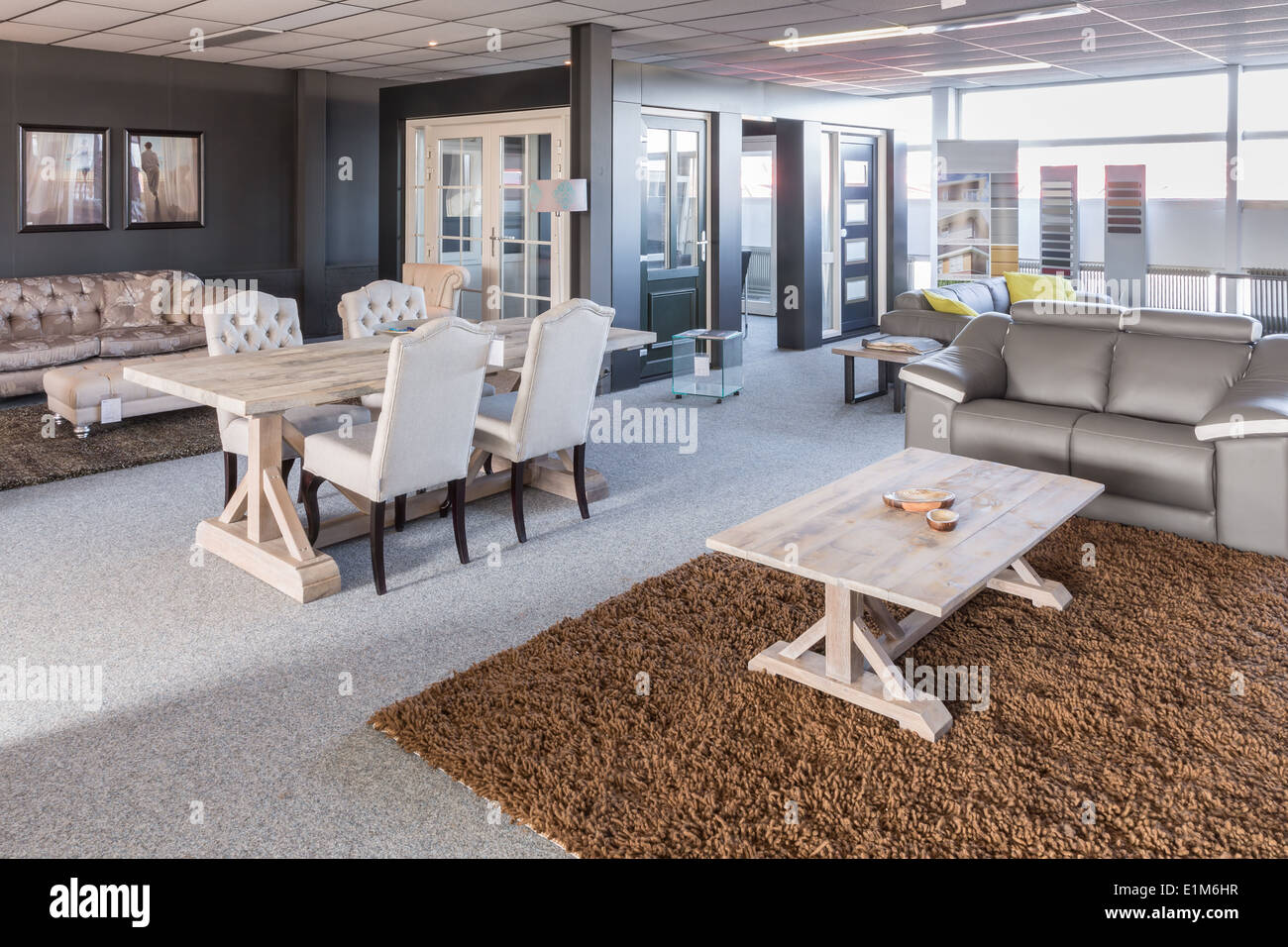 Showroom of modern furniture with tables and chairs Stock Photo - Alamy