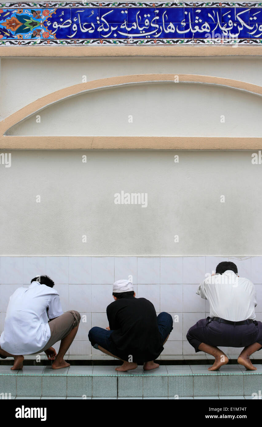 Wash before prayer. Masjid Kampung mosque Stock Photo - Alamy
