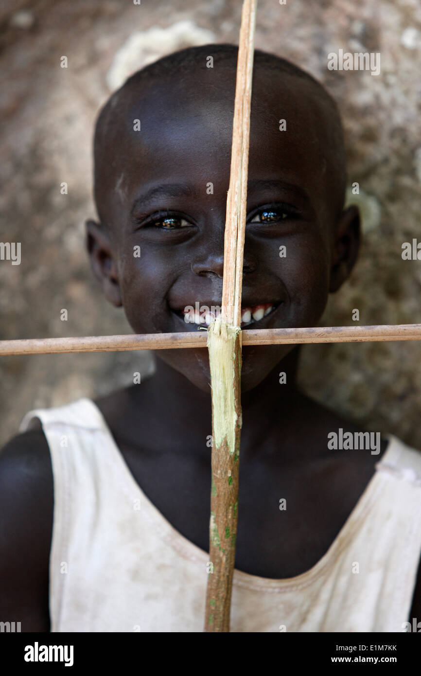Boy with sticks Stock Photo - Alamy