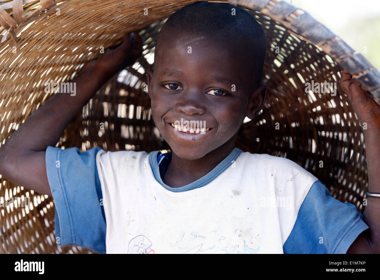 Boy carrying a basket Stock Photo - Alamy