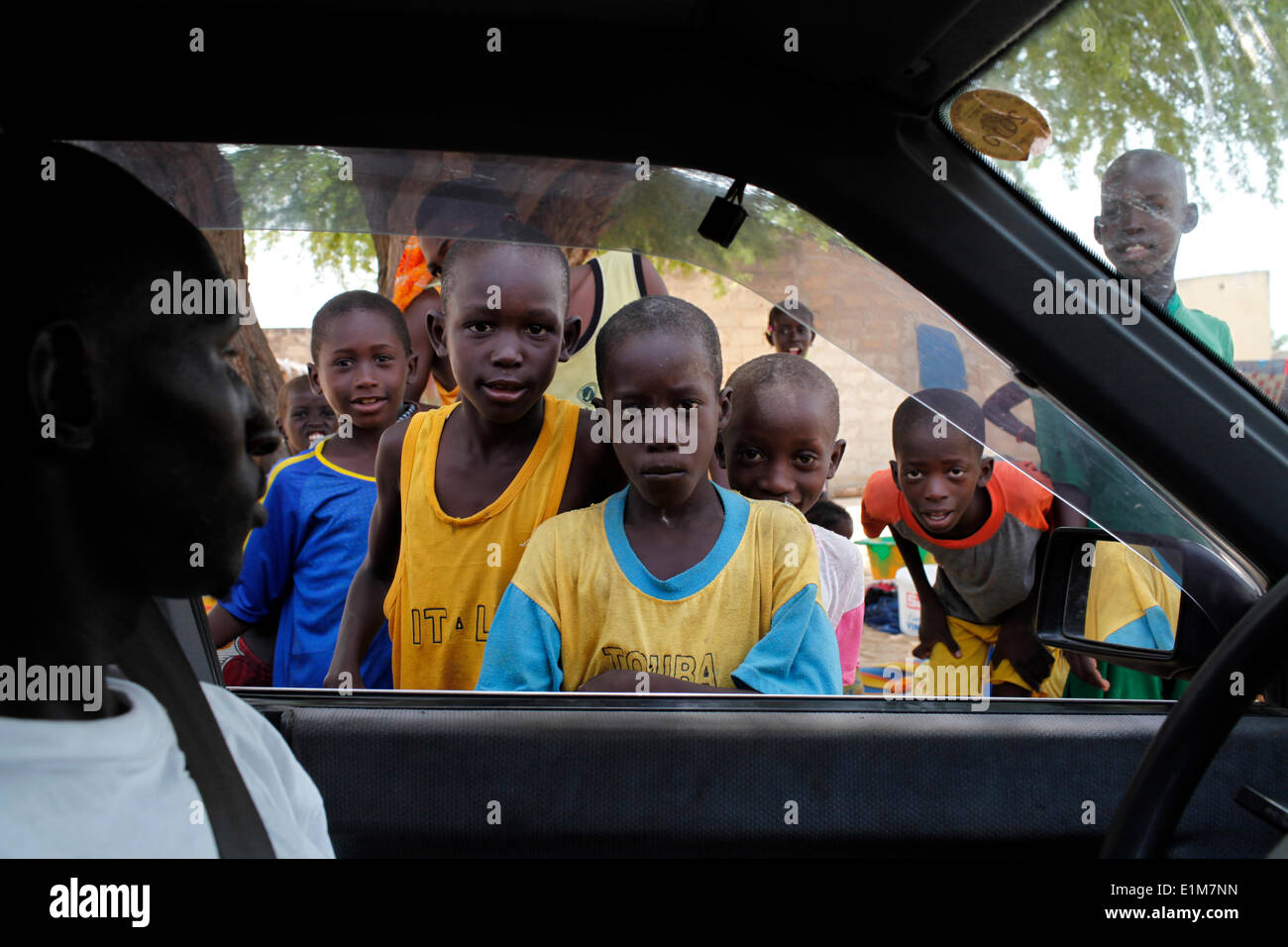 Children gathering to see a foreign visitor Stock Photo - Alamy