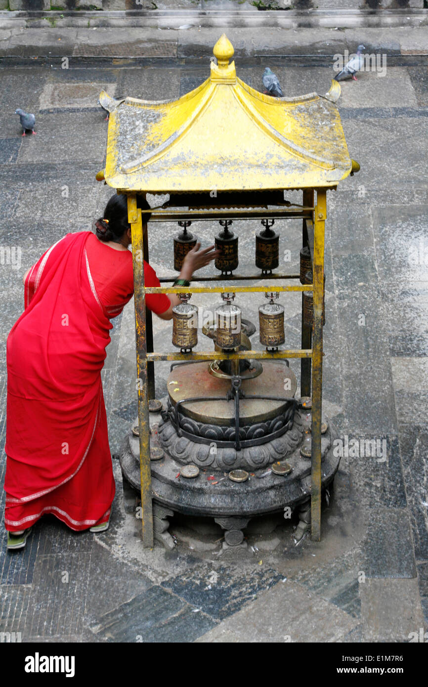 Religious buddhist woman praying wheels hi-res stock photography and ...