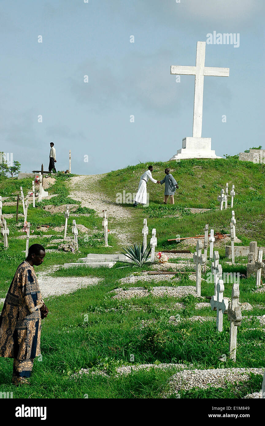 Man praying in a graveyard Stock Photo - Alamy
