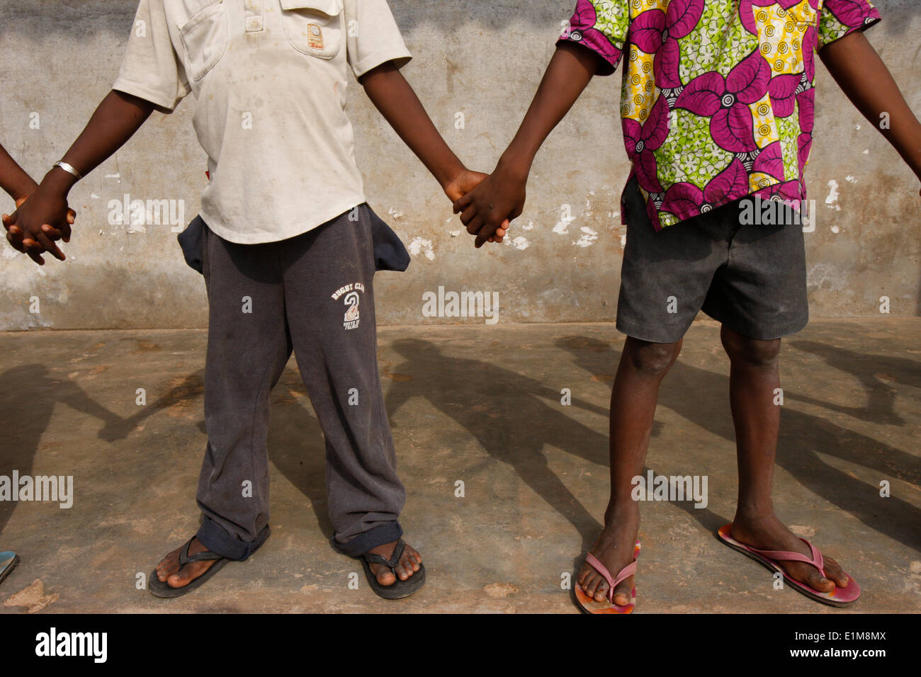 African schoolchildren holding hands Stock Photo - Alamy