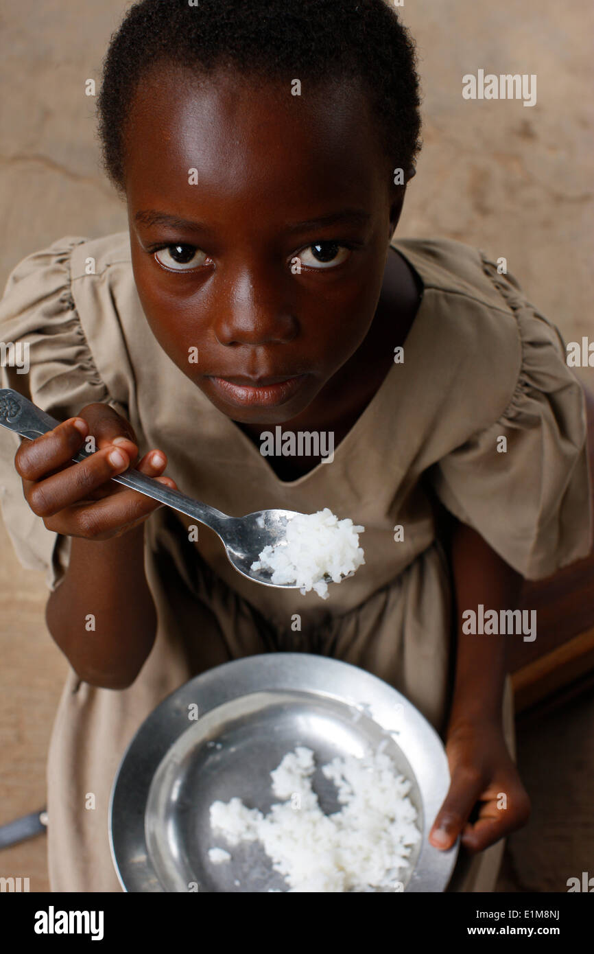 Child eating rice africa hi-res stock photography and images - Alamy