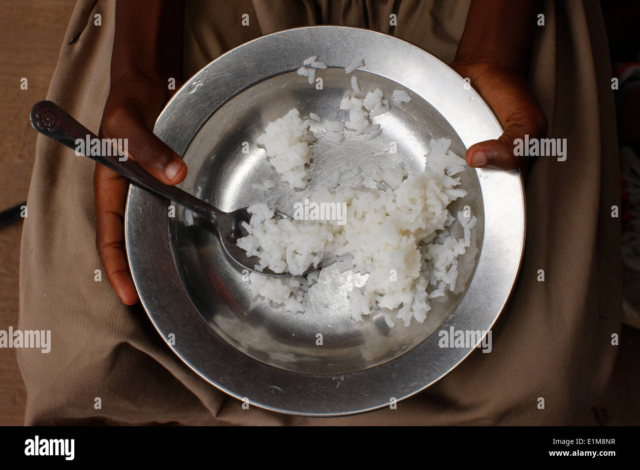 Child eating rice africa hi-res stock photography and images - Alamy
