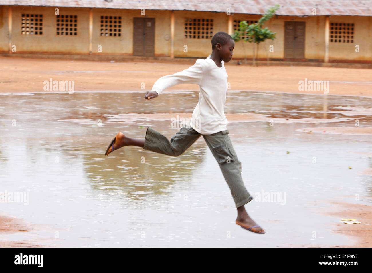 Jump over the water during the rainy season Stock Photo - Alamy