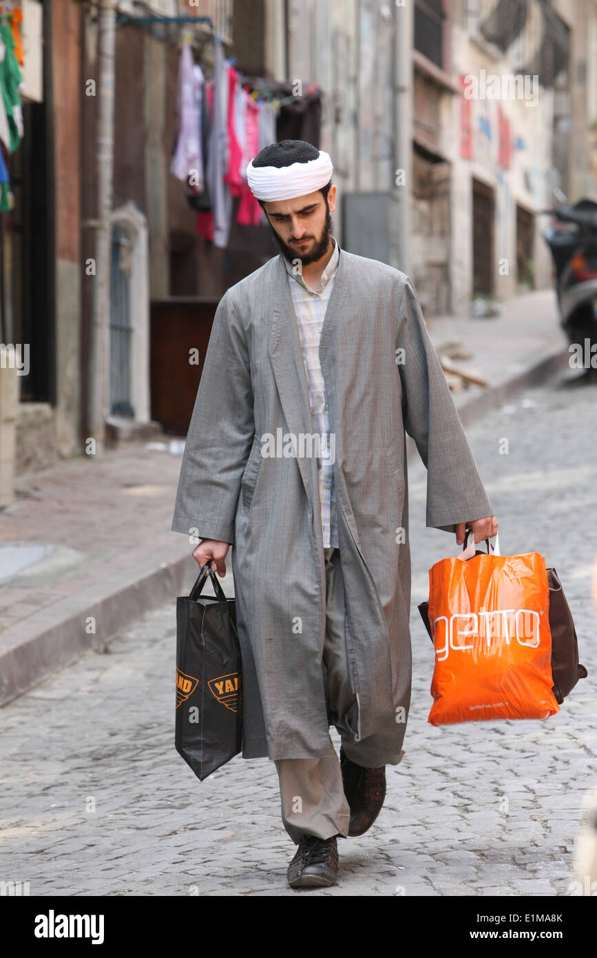 Muslim man walking hi-res stock photography and images - Alamy