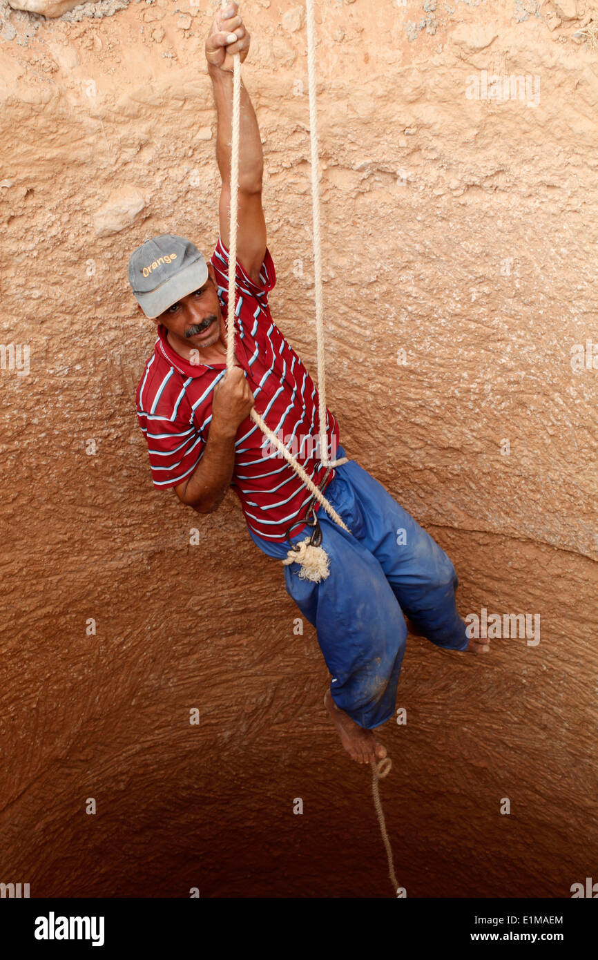 Man digging water well hi-res stock photography and images - Alamy