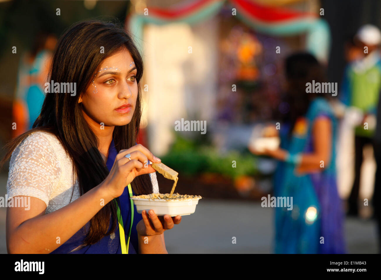 Woman giving tilak at Janmashtami festival at Bhaktivedanta Manor ...