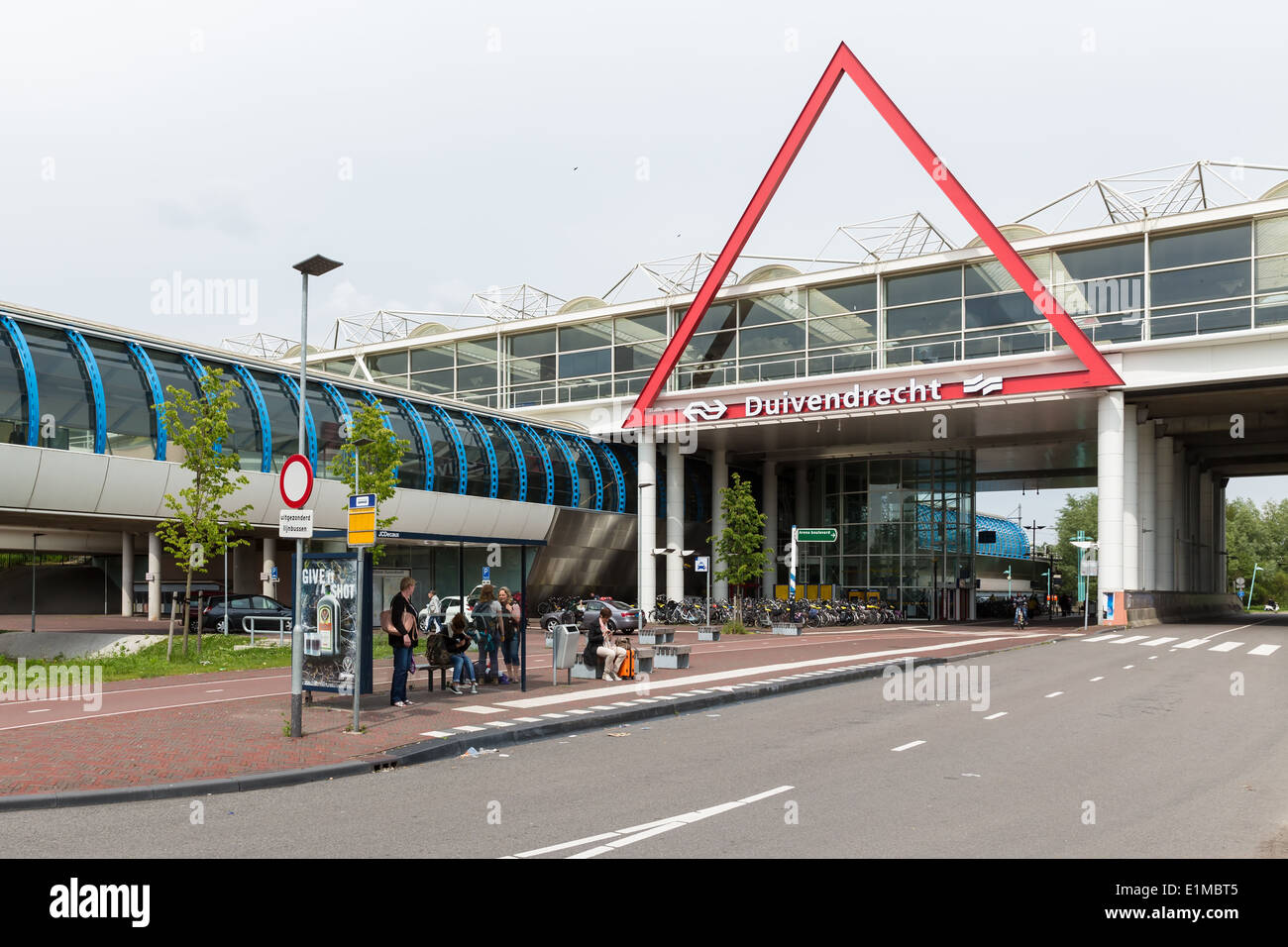 AMSTERDAM, THE NETHERLANDS - MAY 23: Travellers are waiting at a bus ...