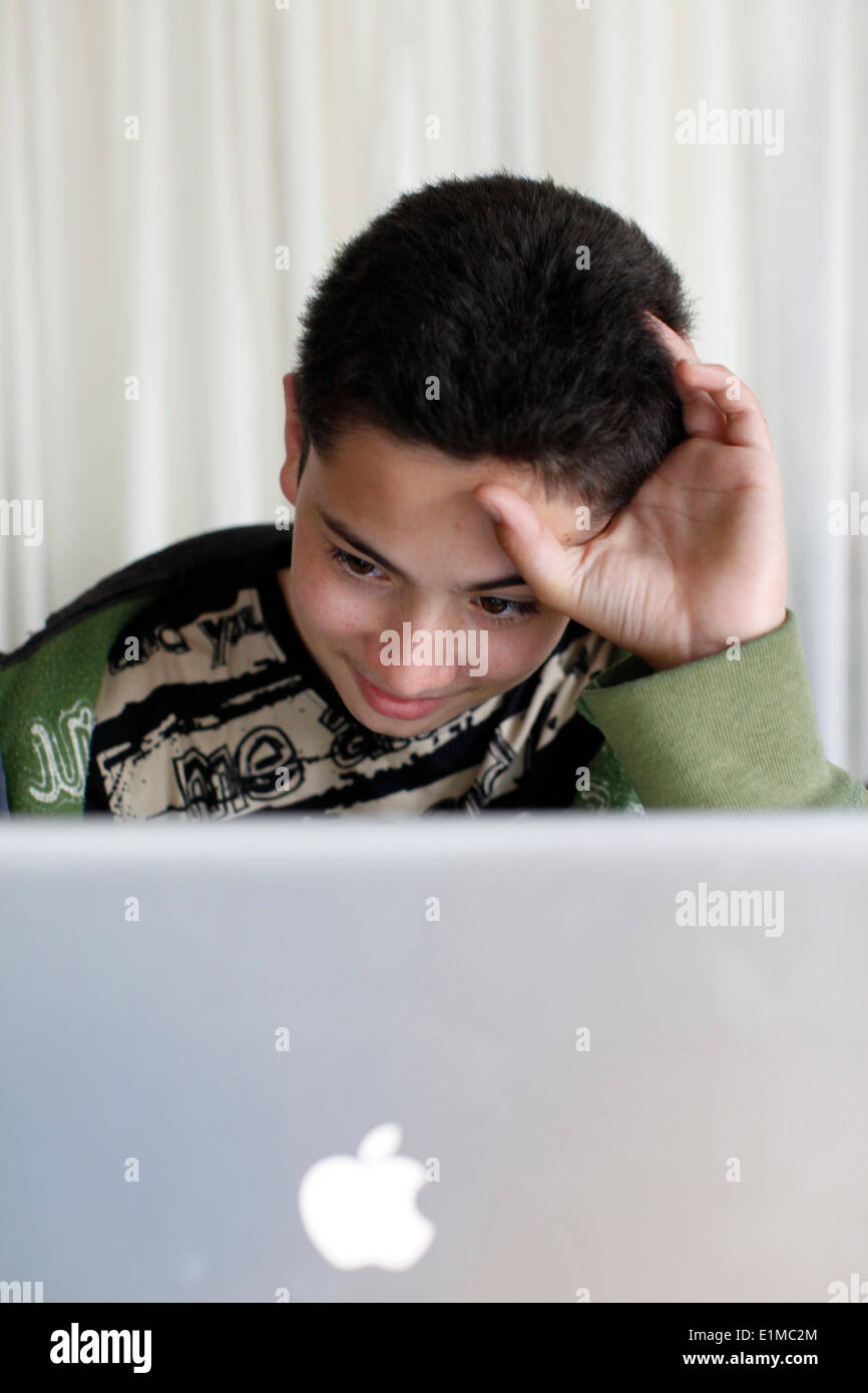 Teenager using a computer Stock Photo - Alamy
