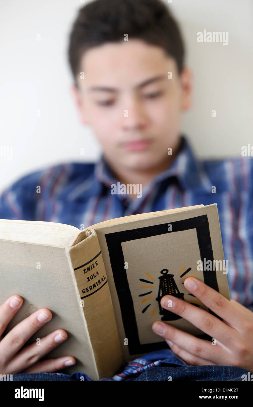 Teenager reading a classic Stock Photo - Alamy