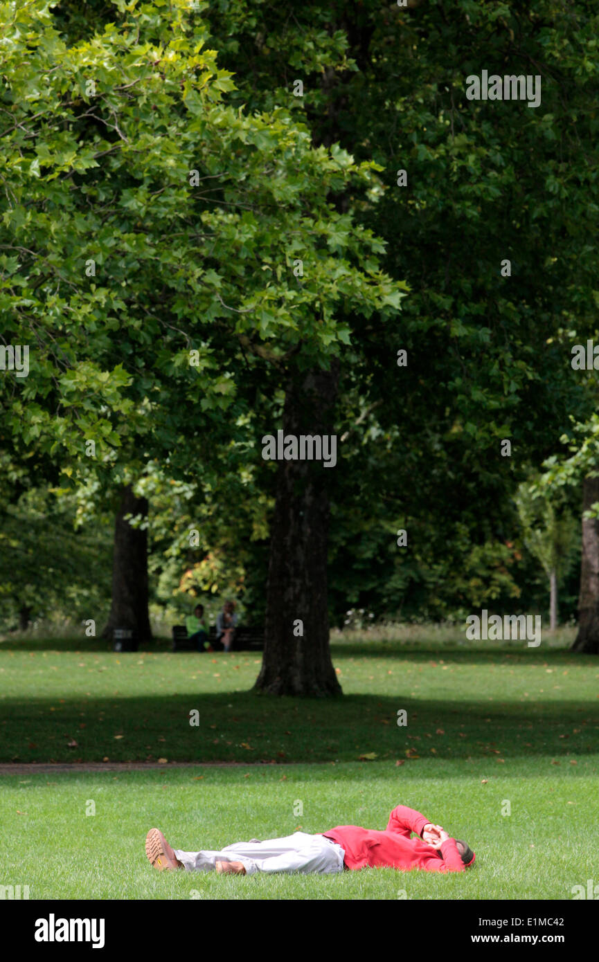 Nap on the grass. Green park Stock Photo - Alamy
