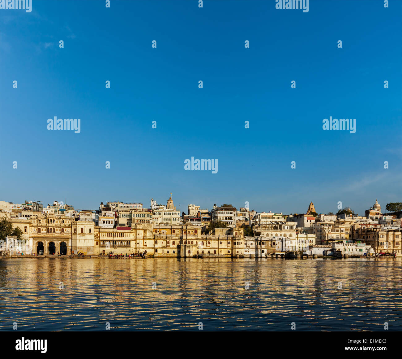 India luxury tourism concept background - Udaipur City Palace from Lake ...
