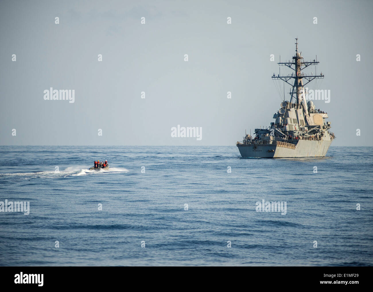 U.S. Sailors, left, assigned to the guided missile destroyer USS Ramage ...