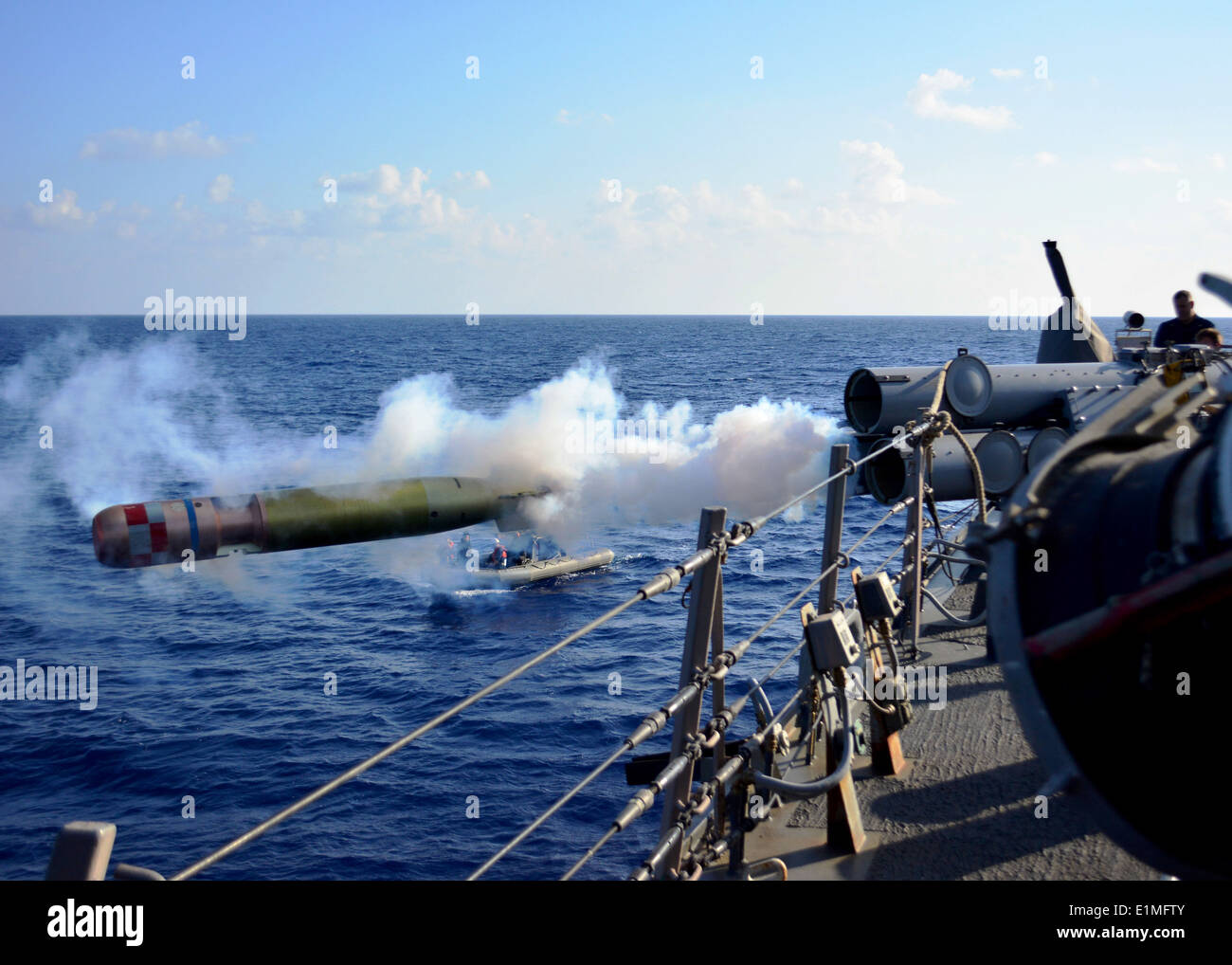 The guided missile destroyer USS Ramage (DDG 61) shoots a torpedo ...