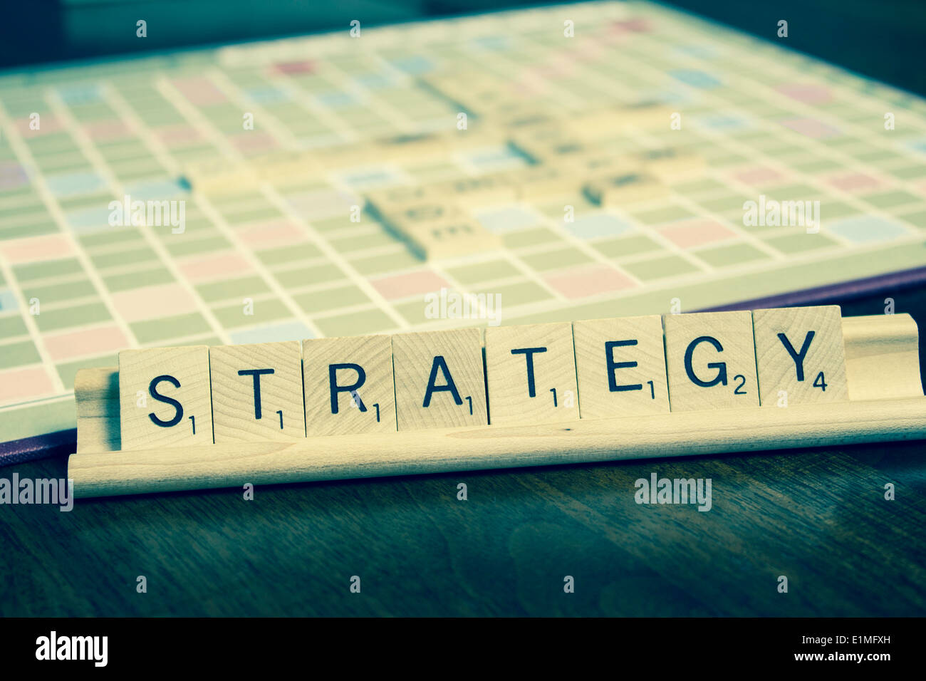 Tiles from a board game spelling out the word Strategy Stock Photo - Alamy