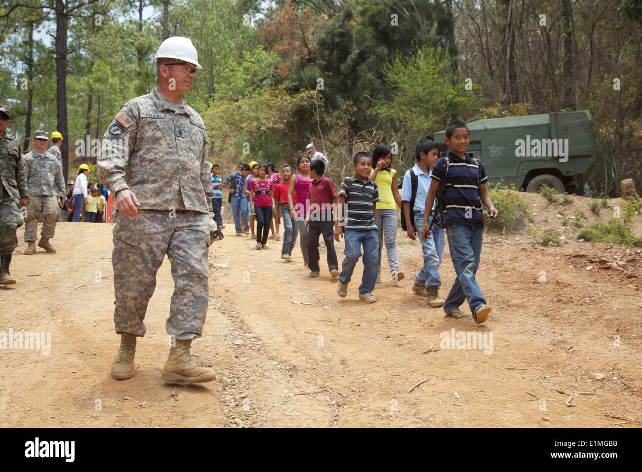 U.S. Army 1st Sgt. Louis Perez, left foreground, assigned to the 1430th ...