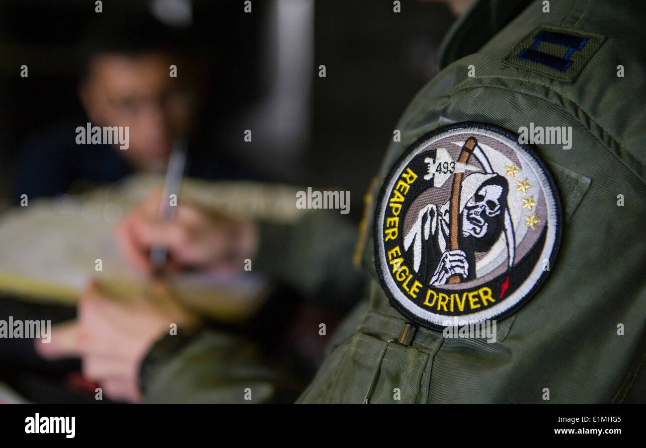 A U.S. Air Force F-15C Eagle aircraft pilot signs off on maintenance ...