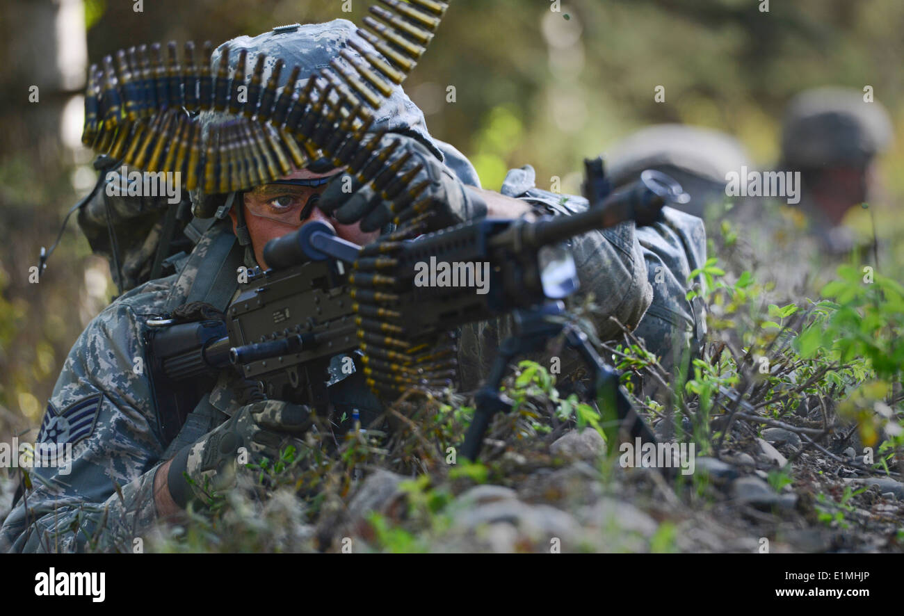U.S. Air Force Staff Sgt. Lucas Wacker provides security with an M240B ...