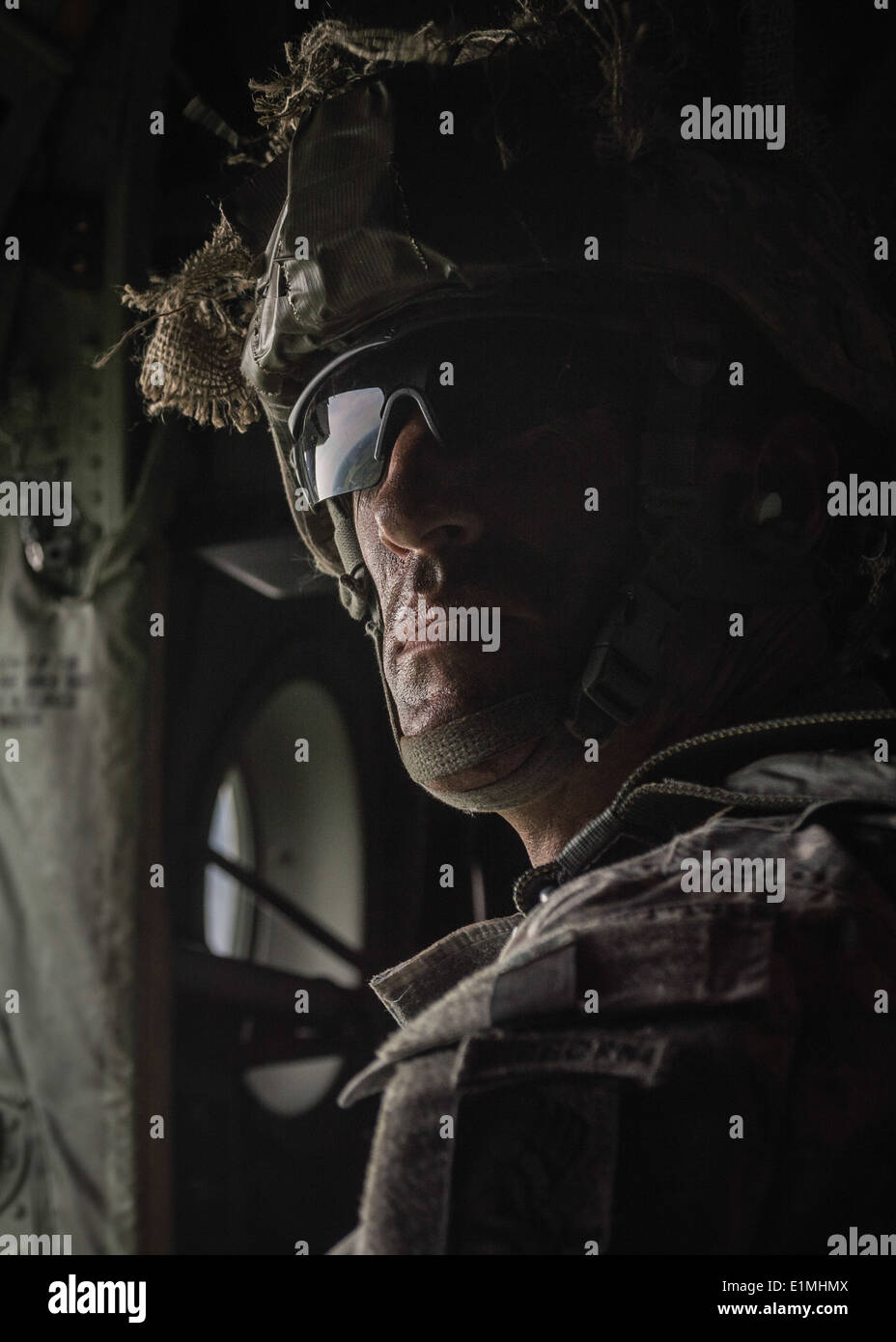 A U.S. Army paratrooper waits inside an Air Force C-130J Super Hercules ...