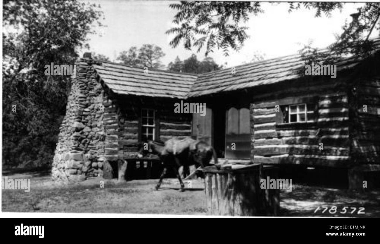 A black and white photo depicting the historic ranger station in a ...