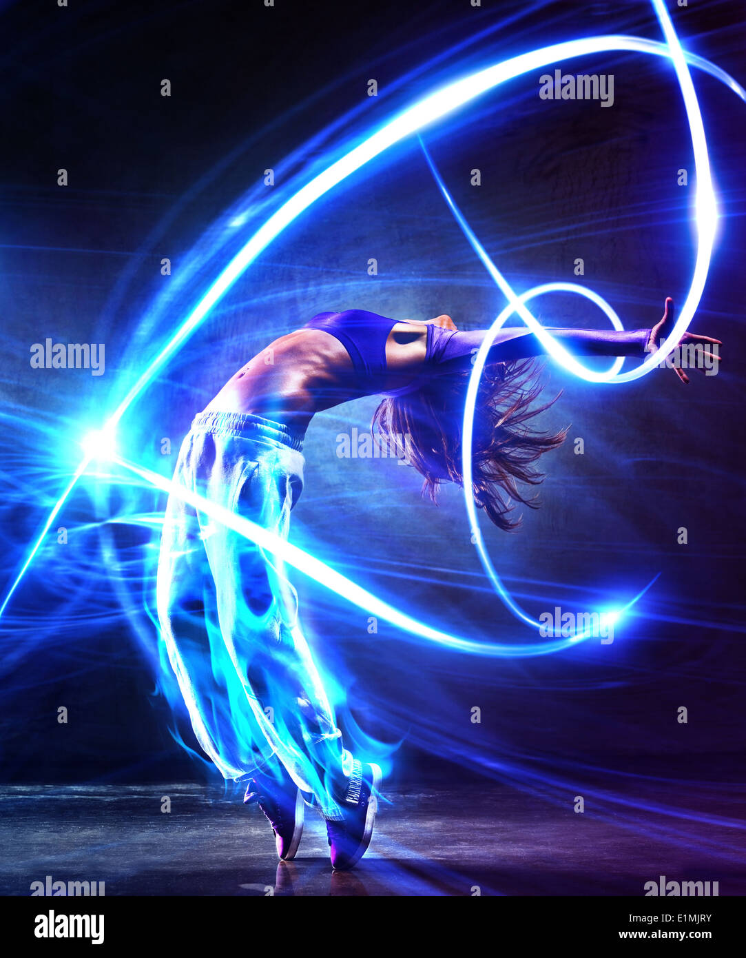 Young woman dancer. With light effects Stock Photo - Alamy