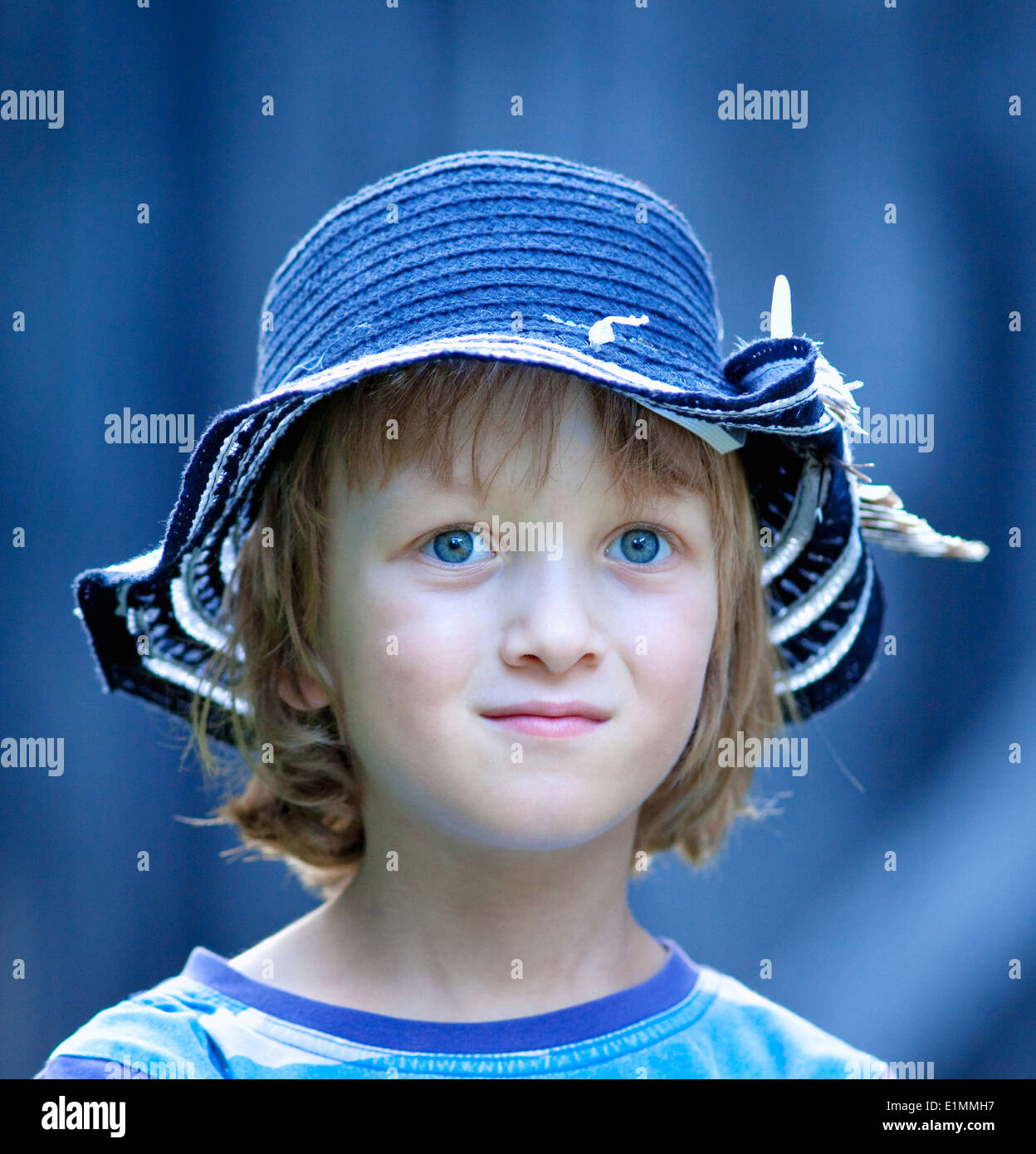 Boy with hat outside hi-res stock photography and images - Alamy