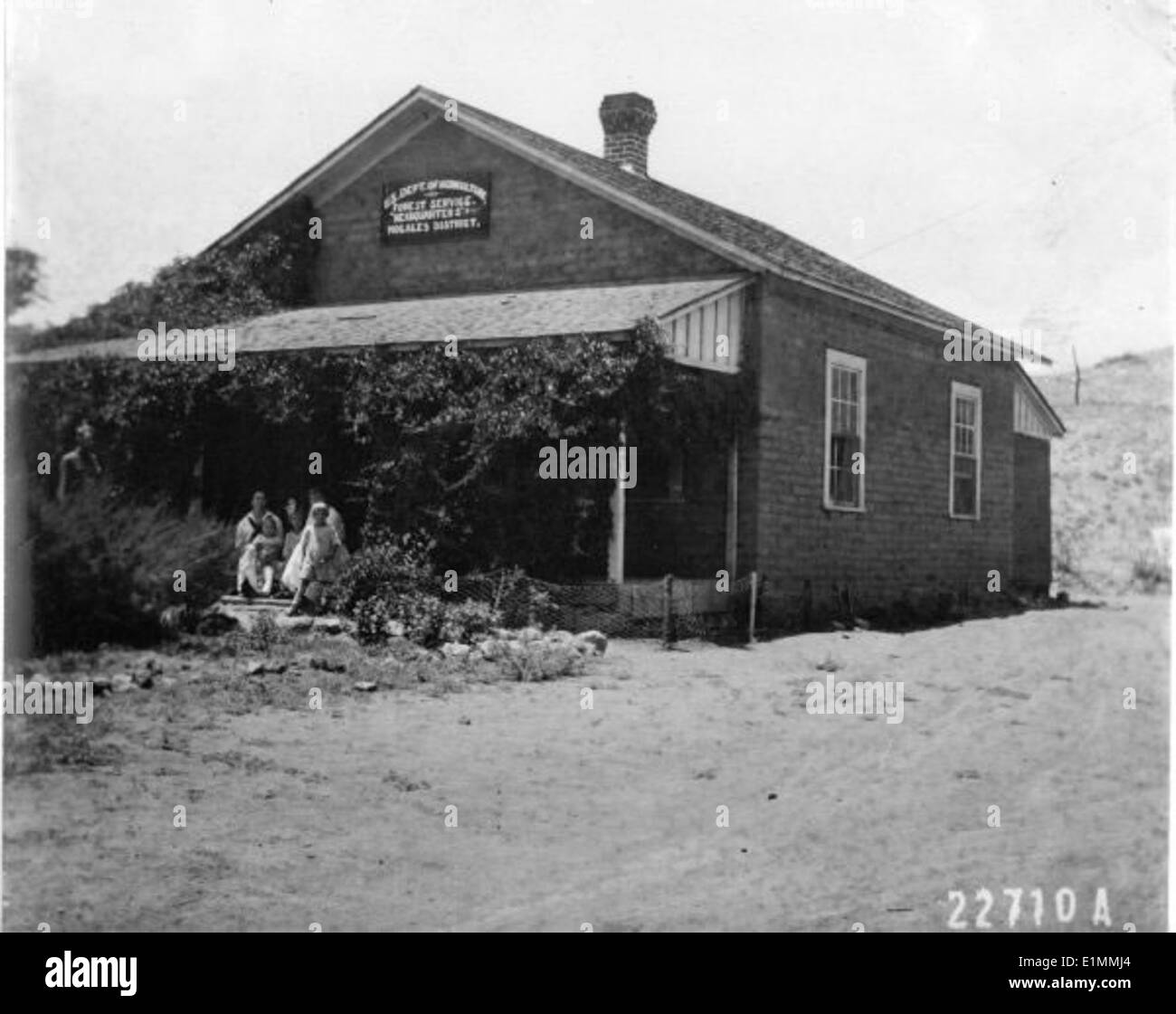 A historic black-and-white image of Forest Rangers at a ranger station ...