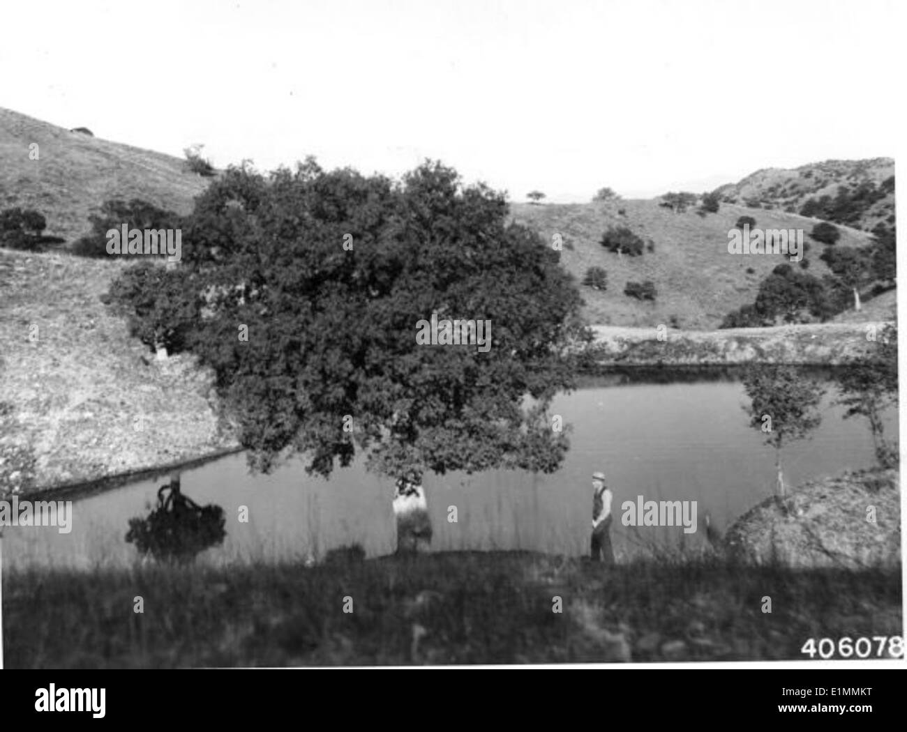 A historic black-and-white photograph depicting a forest ranger station ...