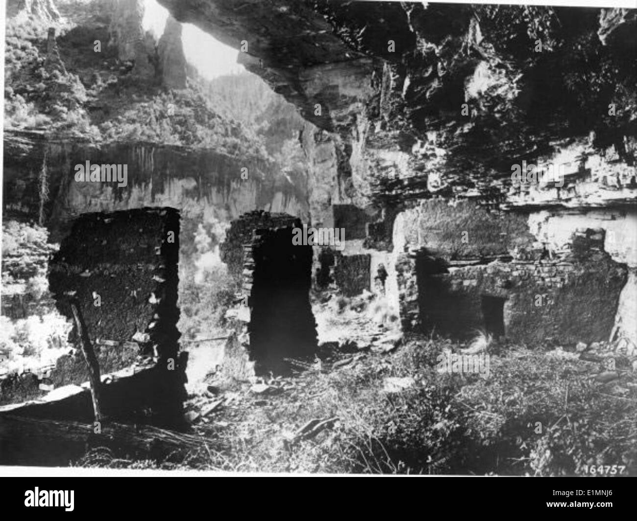 The image shows ancient cliff dwellings in Tonto National Forest ...