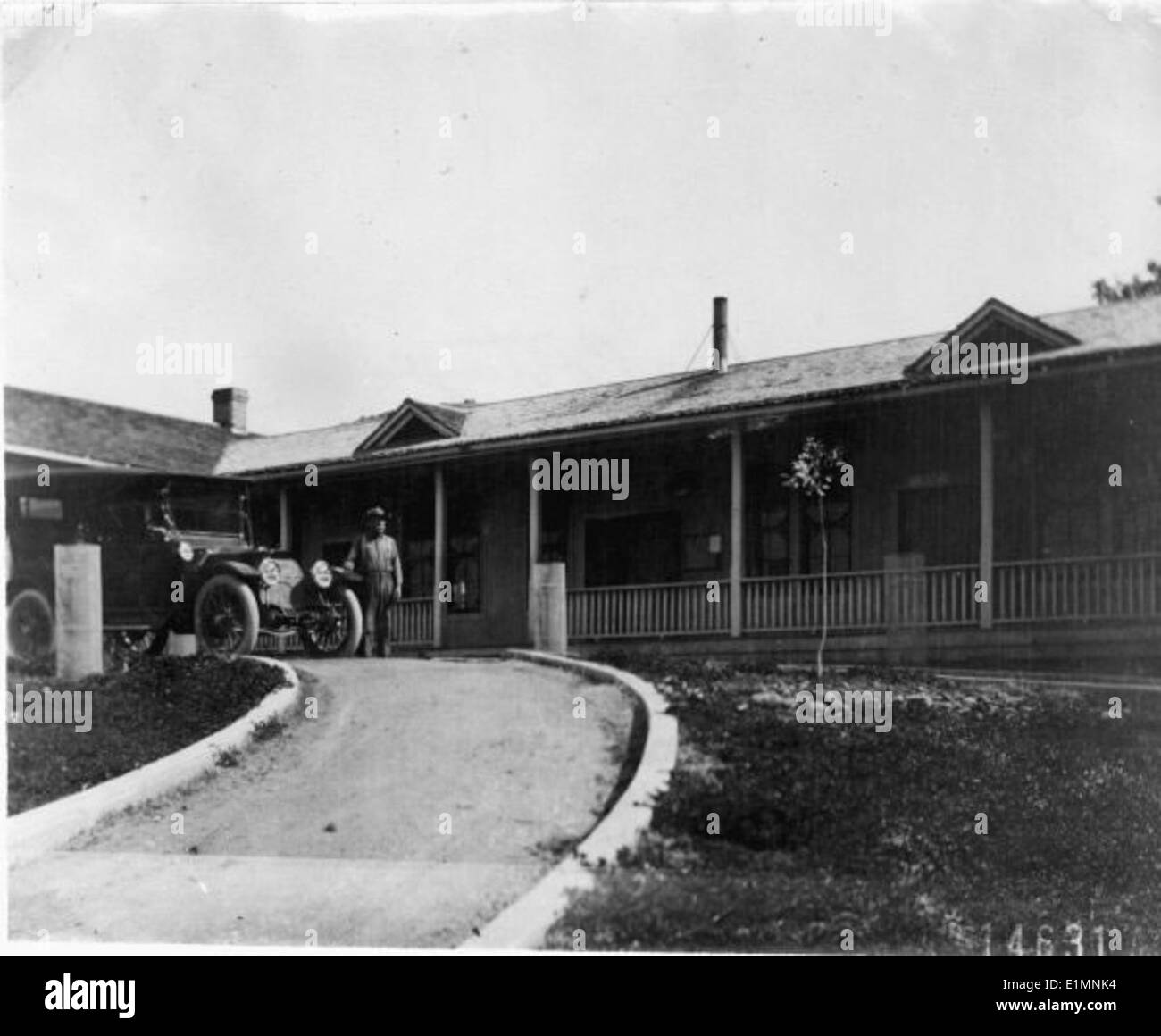 Man near black car Black and White Stock Photos & Images - Alamy
