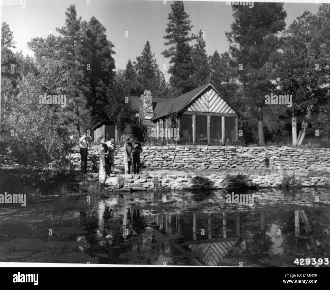 A historical photograph captures people interacting with nature in the ...