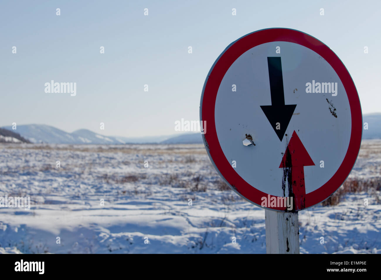 rusty russian road sign snow siberia two direction Stock Photo - Alamy