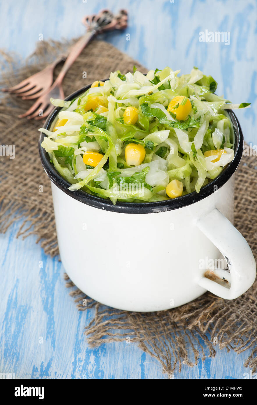 Cabbage salad with corn in vintage cup, selective focus Stock Photo - Alamy