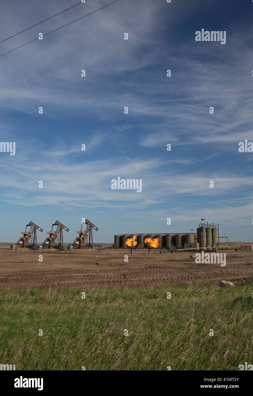Watford City, North Dakota - Natural gas is flared off as oil is pumped ...