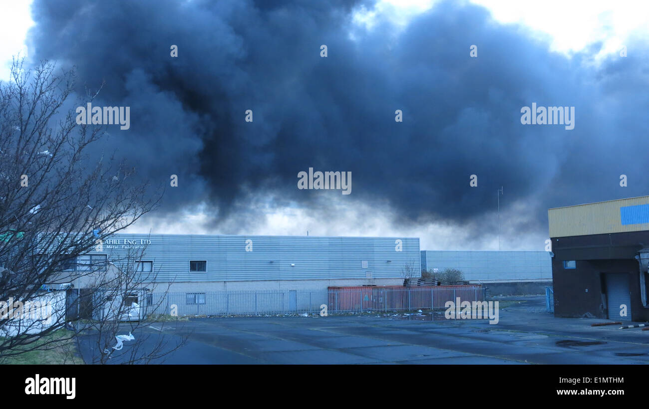 A cloud of black smoke covers a building during a major fire at the ...