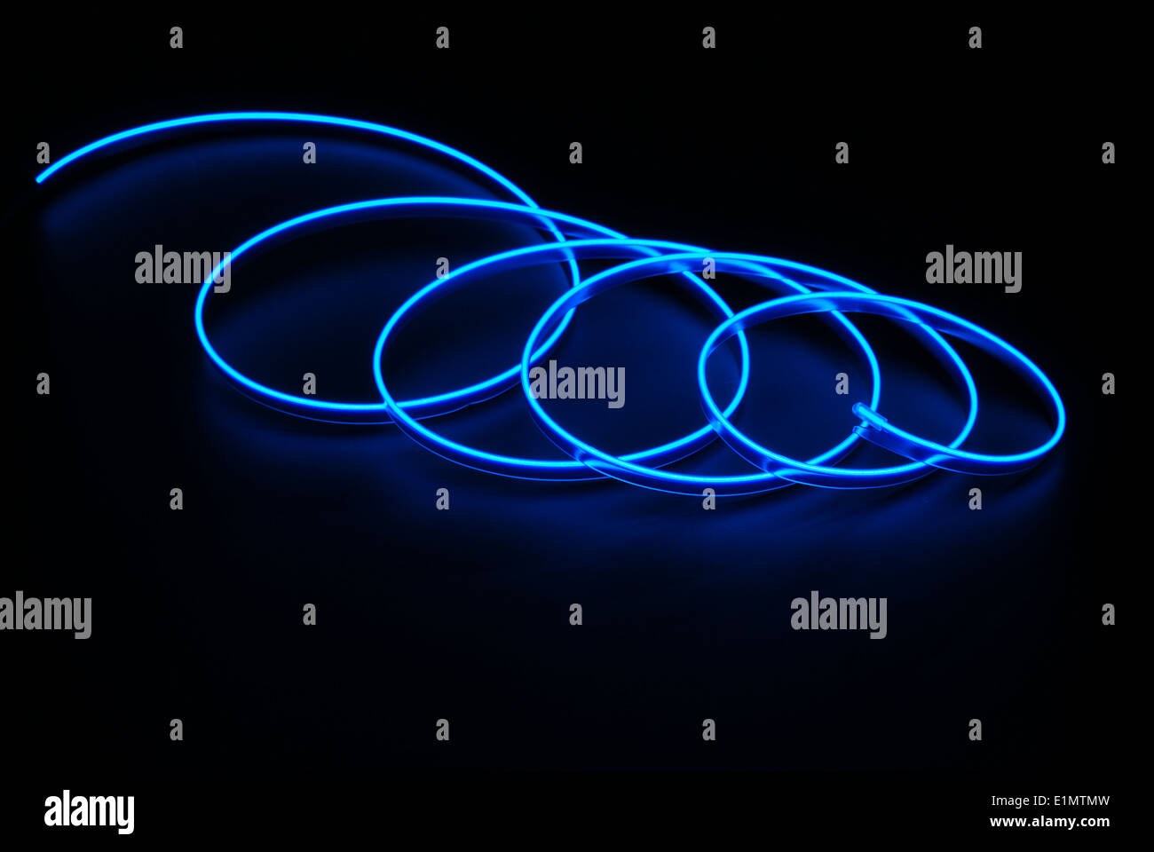Blue neon stripe is isolated on the black background Stock Photo - Alamy