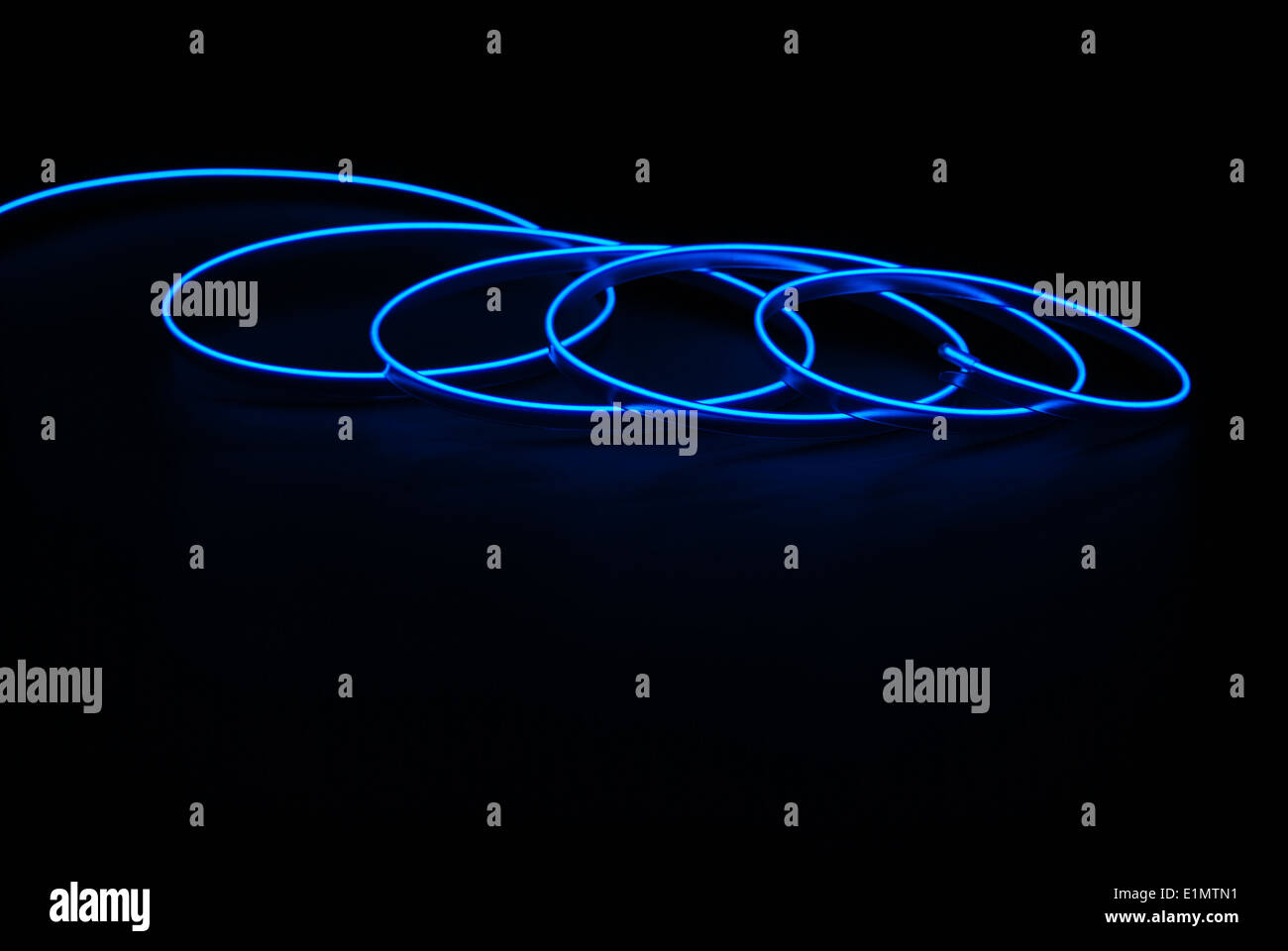 Blue neon stripe is isolated on the black background Stock Photo - Alamy