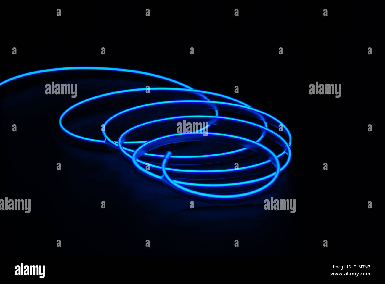 Blue neon stripe is isolated on the black background Stock Photo - Alamy