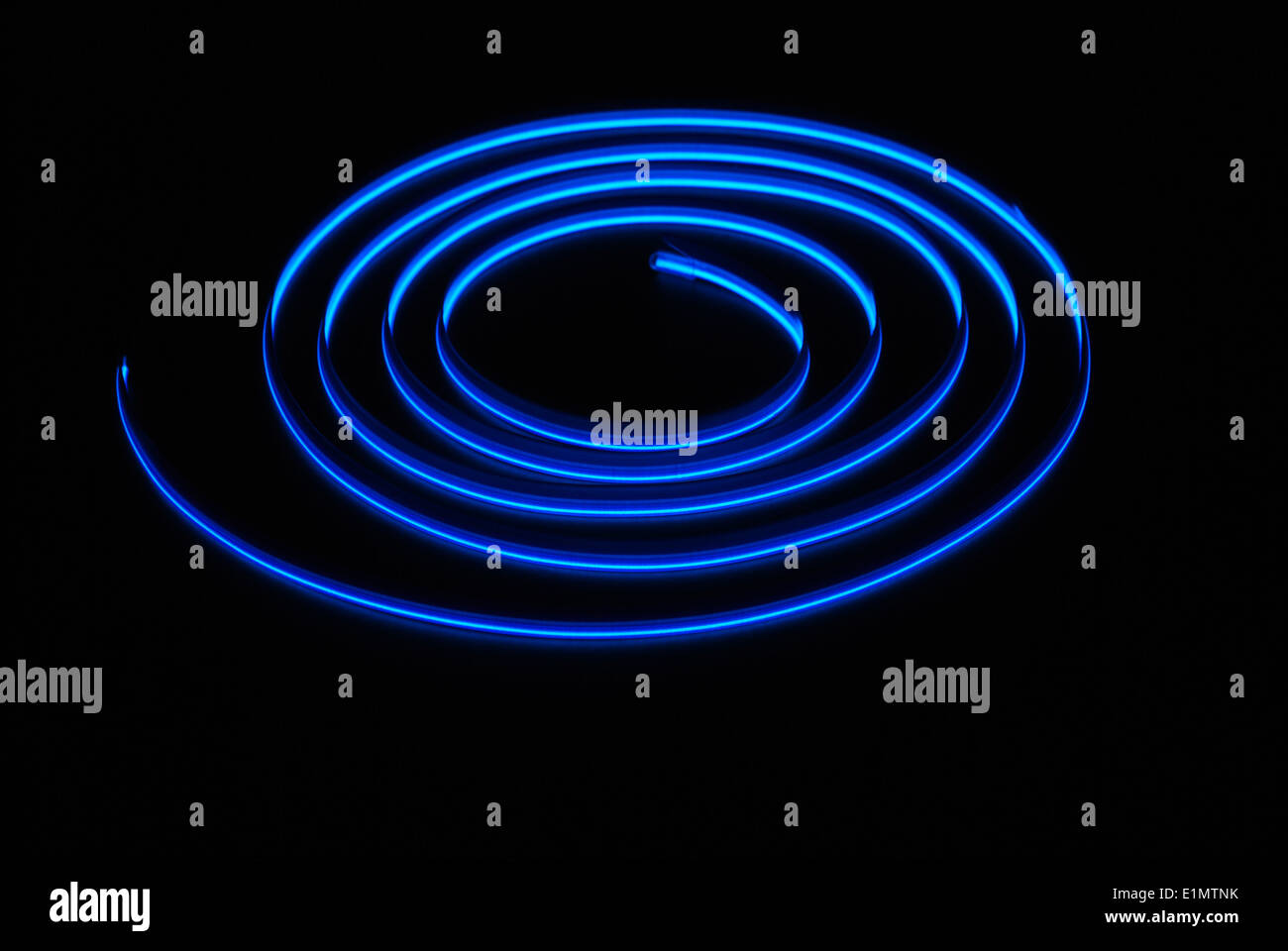Blue neon stripe is isolated on the black background Stock Photo - Alamy