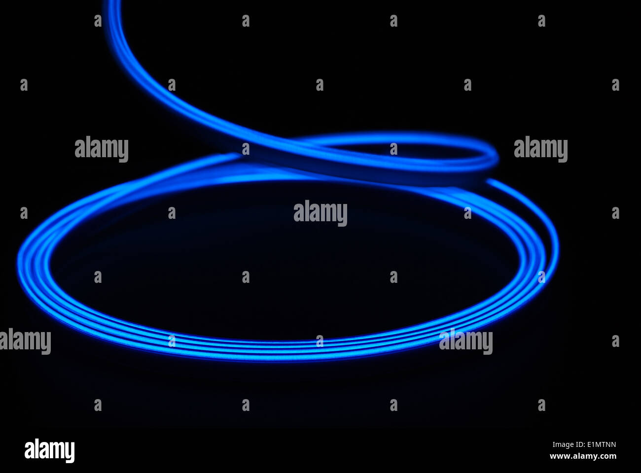 Blue neon stripe is isolated on the black background Stock Photo - Alamy
