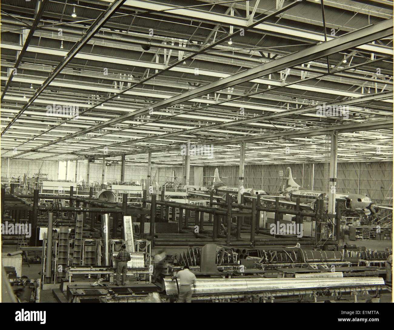 This image shows the assembly process of the Convair 880 aircraft, with ...